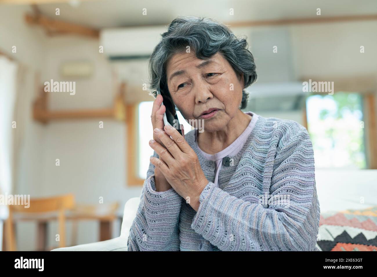 Woman sad making phone call home hi-res stock photography and images ...