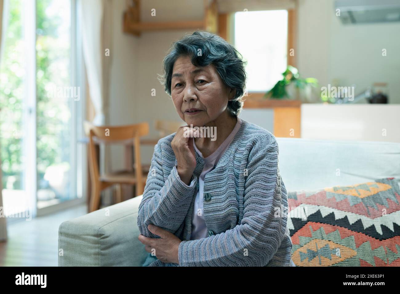 Anxious senior woman Stock Photo - Alamy
