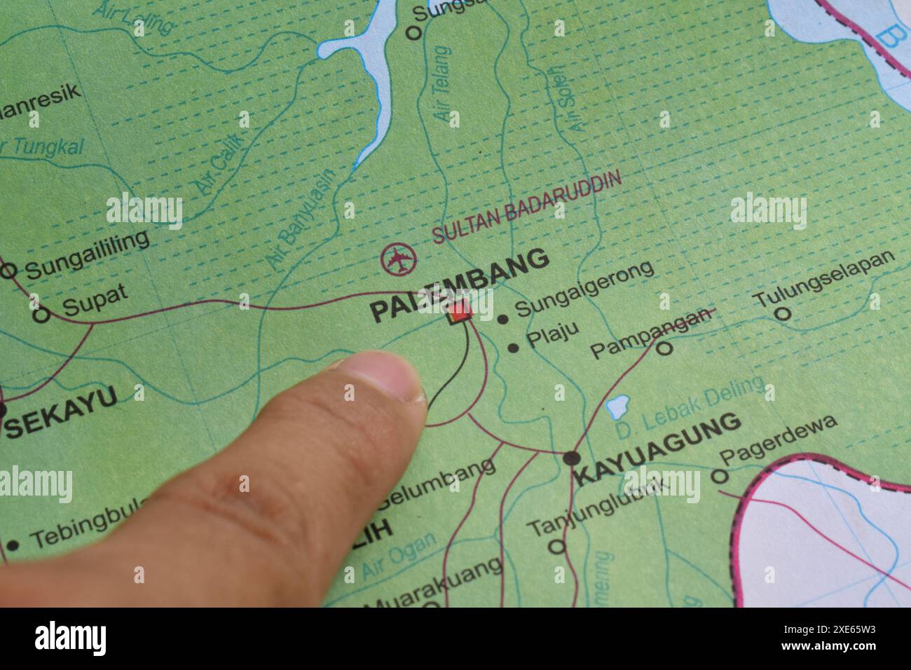 Finger pointing at Map of Palembang City, is the capital of the ...
