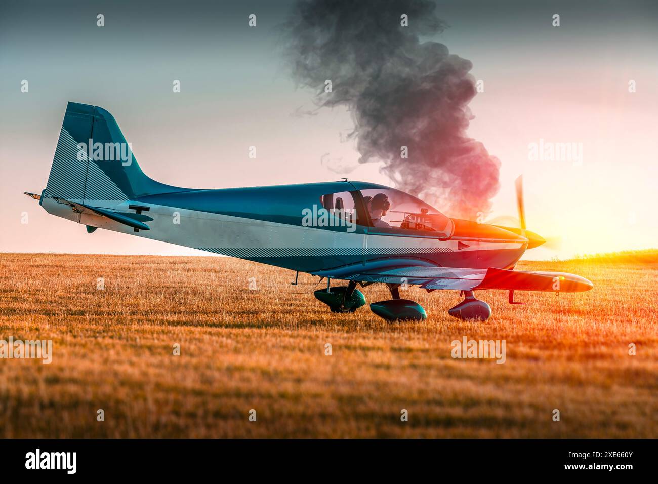 Plane emergency landing. Airplane with smoke from the engine. Fire in ...