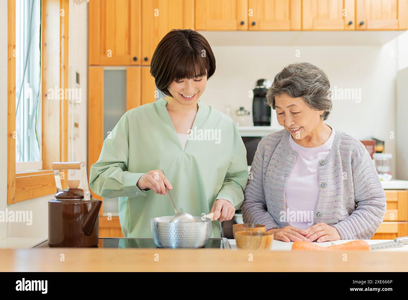 Cooking asian daughter senior hi-res stock photography and images - Alamy