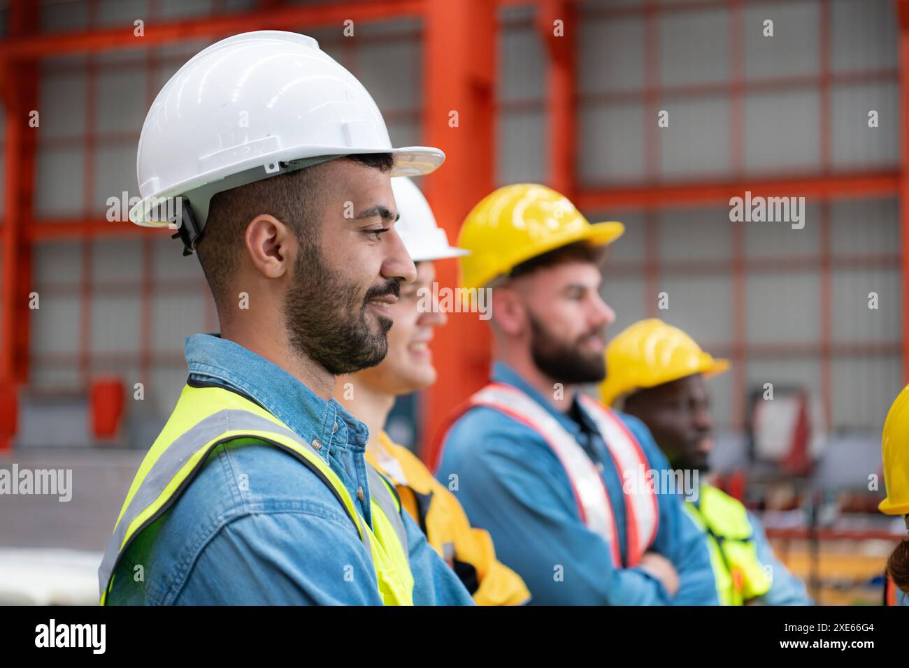 Portrait of engineers and industrial workers in hardhats at construction site Stock Photo - Alamy