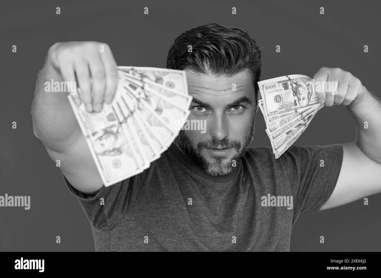 Man hold money on yellow studio isolated background. Rich man with ...