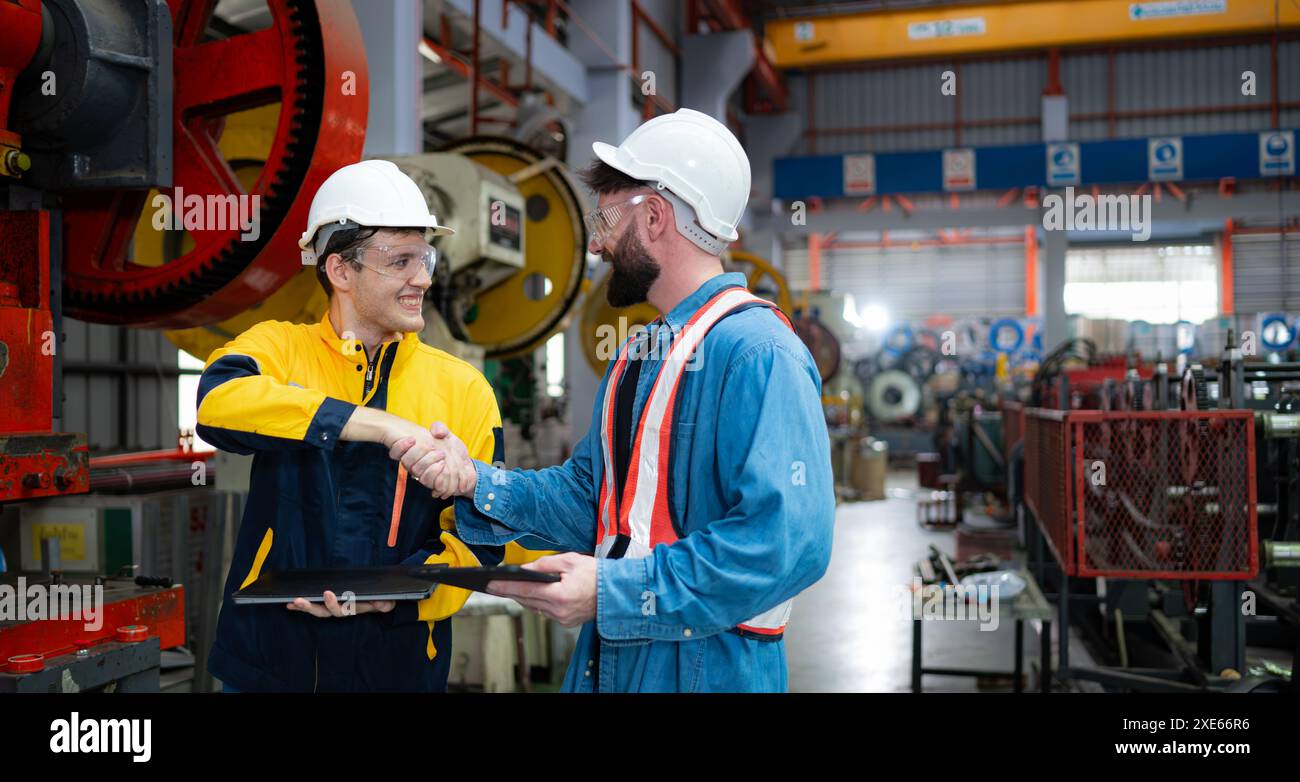 Engineer and technician discussing machinery in factory to plan ... Engineer and technician discussing machinery in factory to plan ...