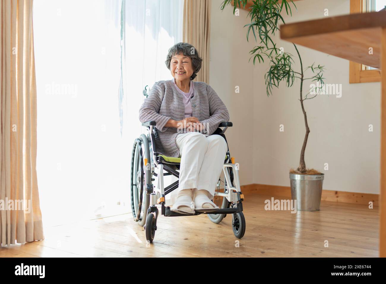 Senior woman in wheelchair Stock Photo - Alamy