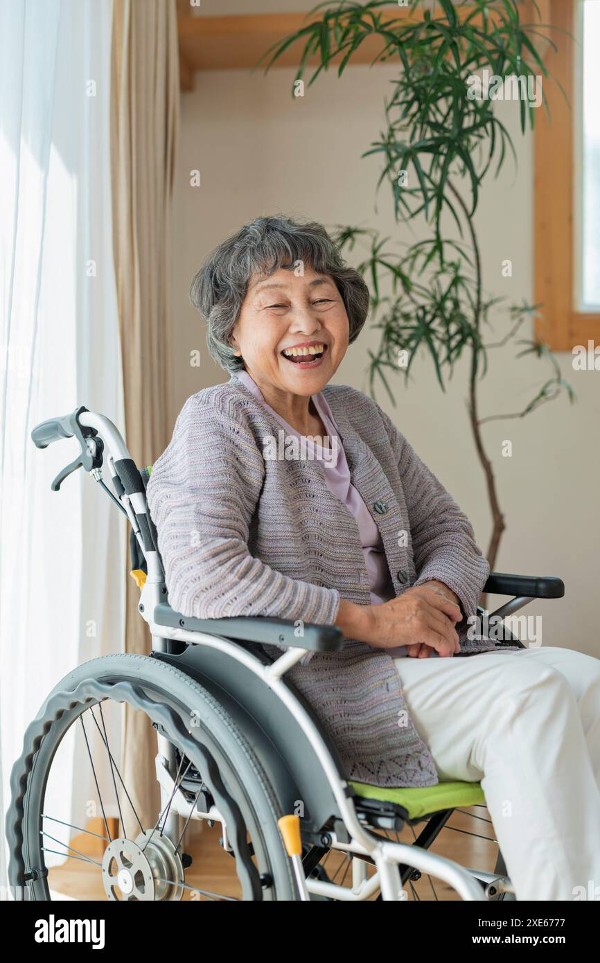 Senior woman in wheelchair Stock Photo - Alamy