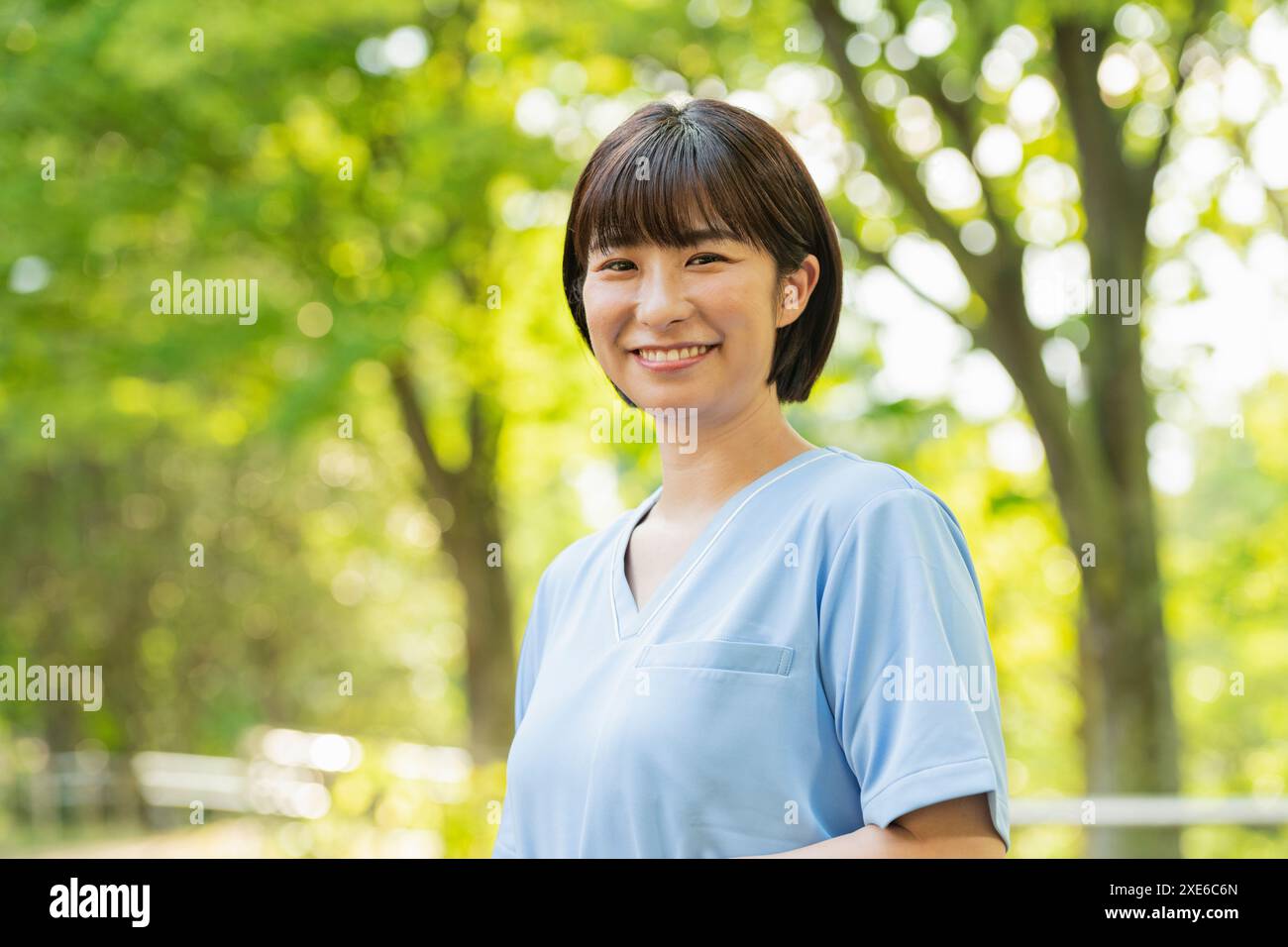 Smiling female healthcare worker Stock Photo - Alamy