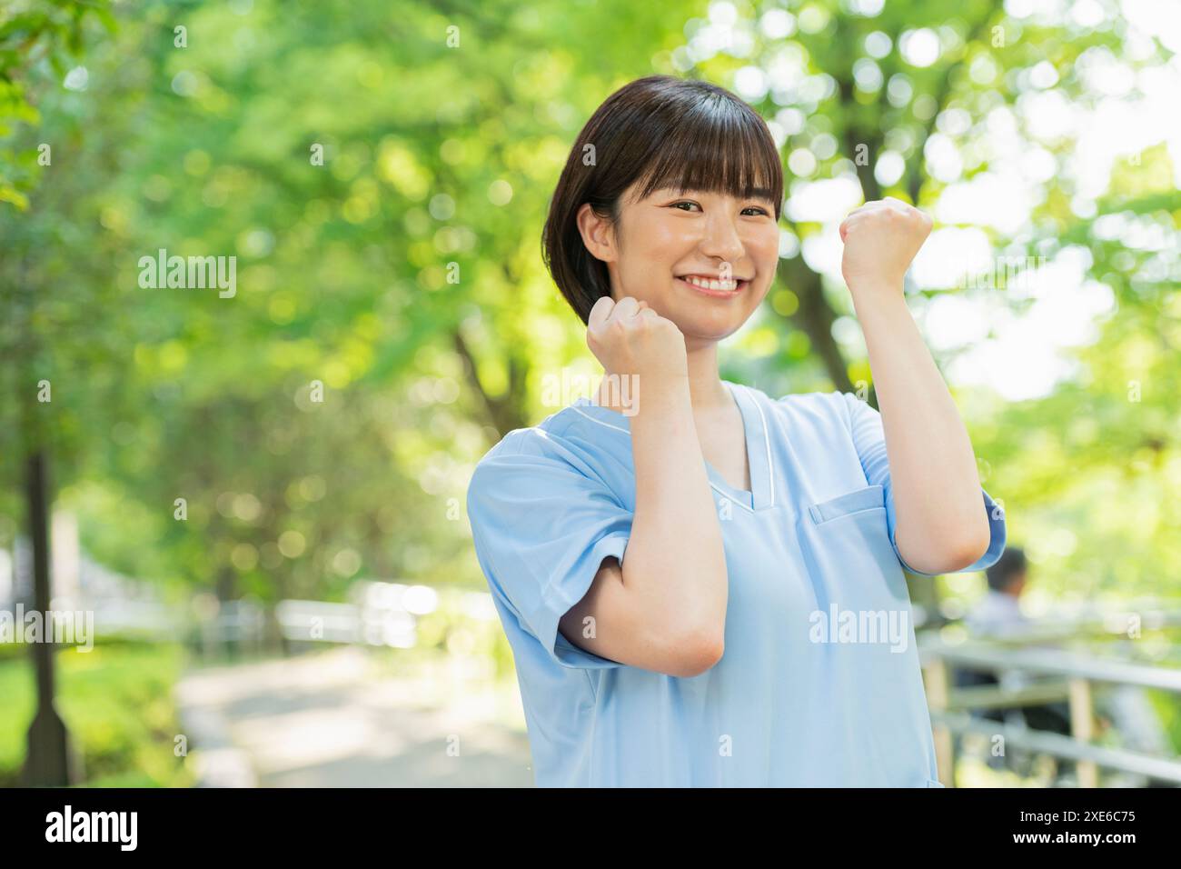 Smiling female healthcare worker Stock Photo - Alamy