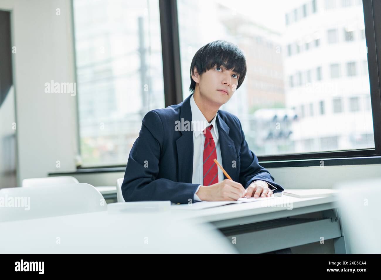 High school boy taking a class at a prep school Stock Photo - Alamy