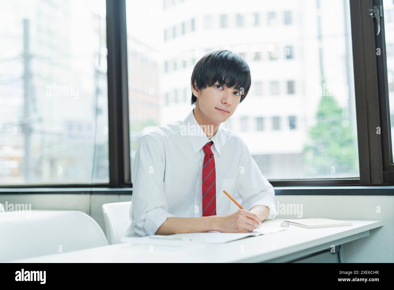 Prep school, male high school student, smiling Stock Photo - Alamy