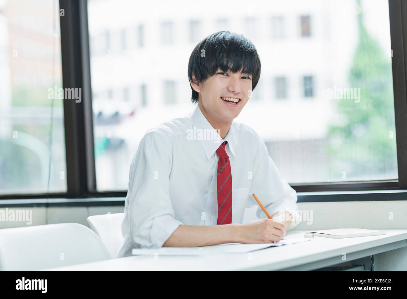 Prep school, male high school student, smiling Stock Photo - Alamy