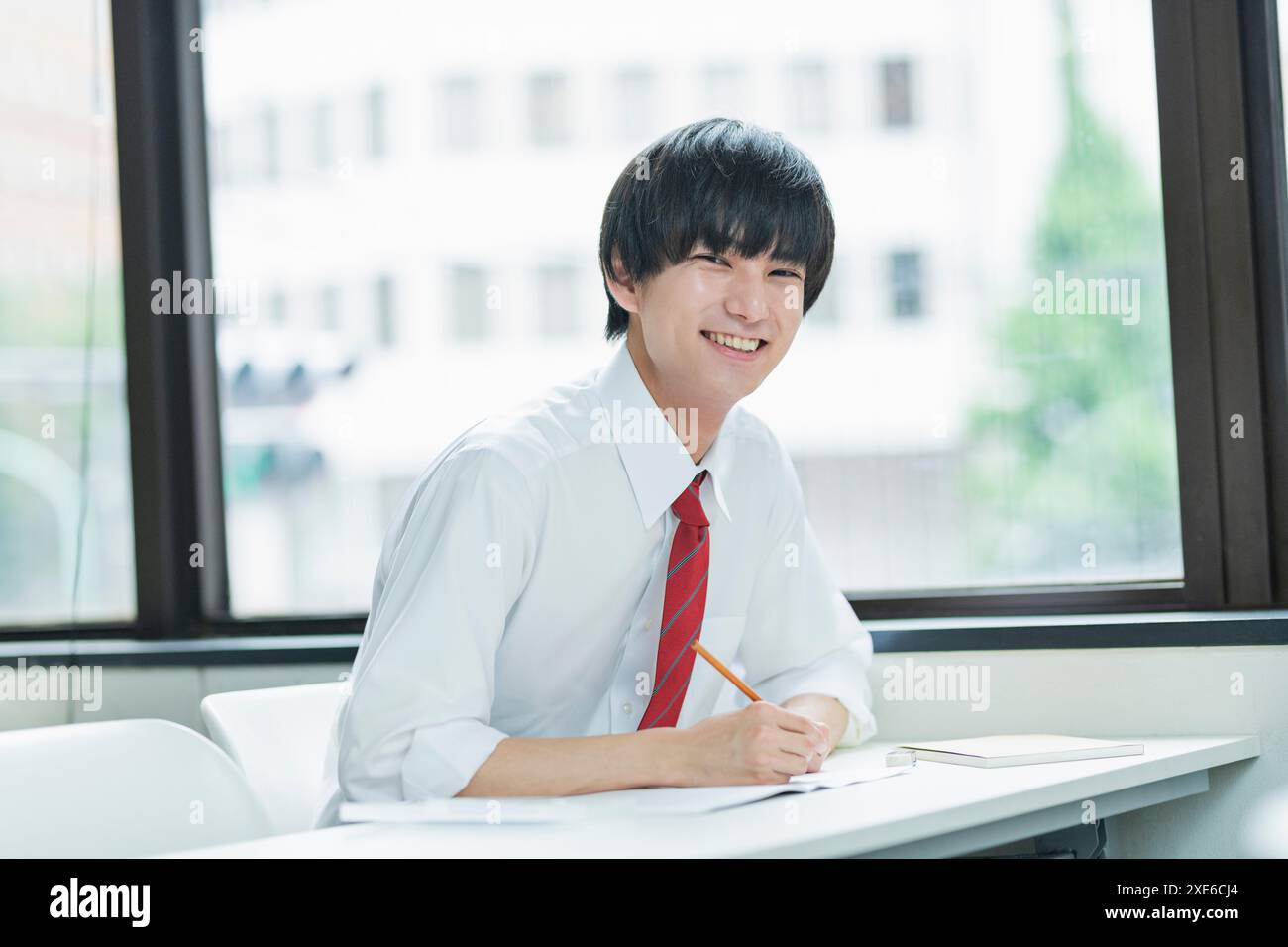 Prep school, male high school student, smiling Stock Photo - Alamy