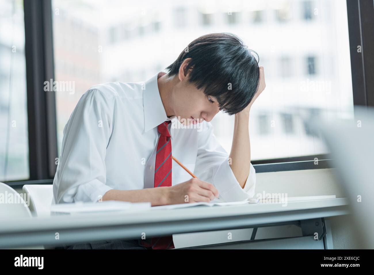 High school boy taking an exam Stock Photo - Alamy