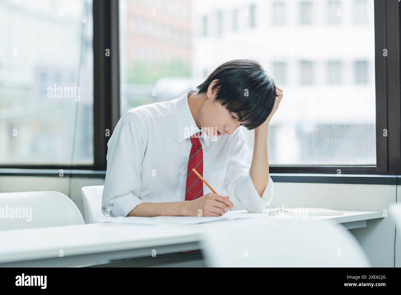 High school boy taking an exam Stock Photo - Alamy