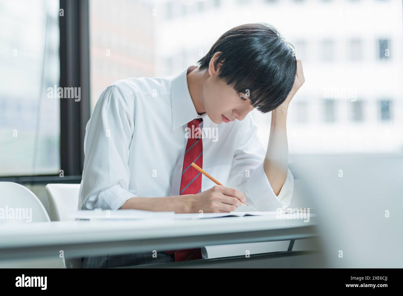 High school boy taking an exam Stock Photo - Alamy