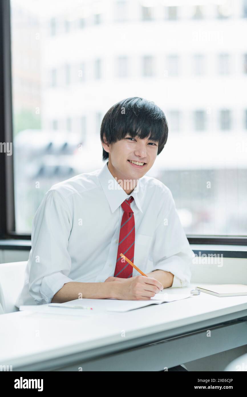 Prep school, male high school student, smiling Stock Photo - Alamy