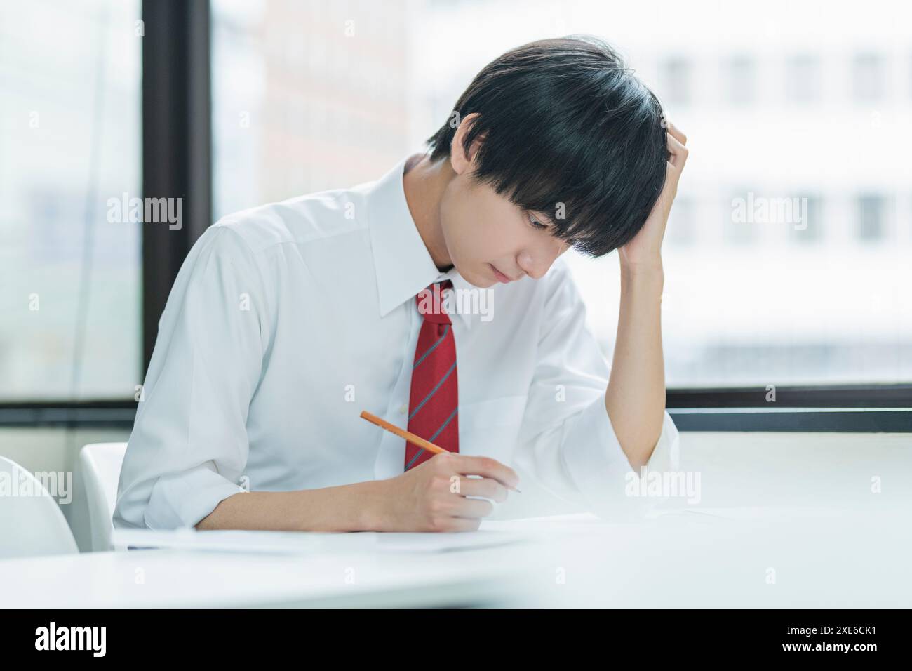 High school boy taking an exam Stock Photo - Alamy