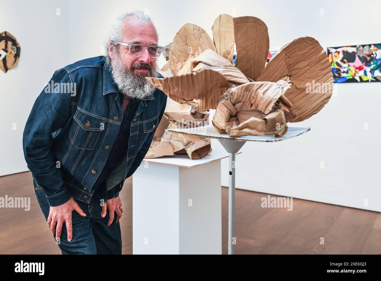 London, UK. 26th June, 2024. Artist John Bunker poses with some of his ...