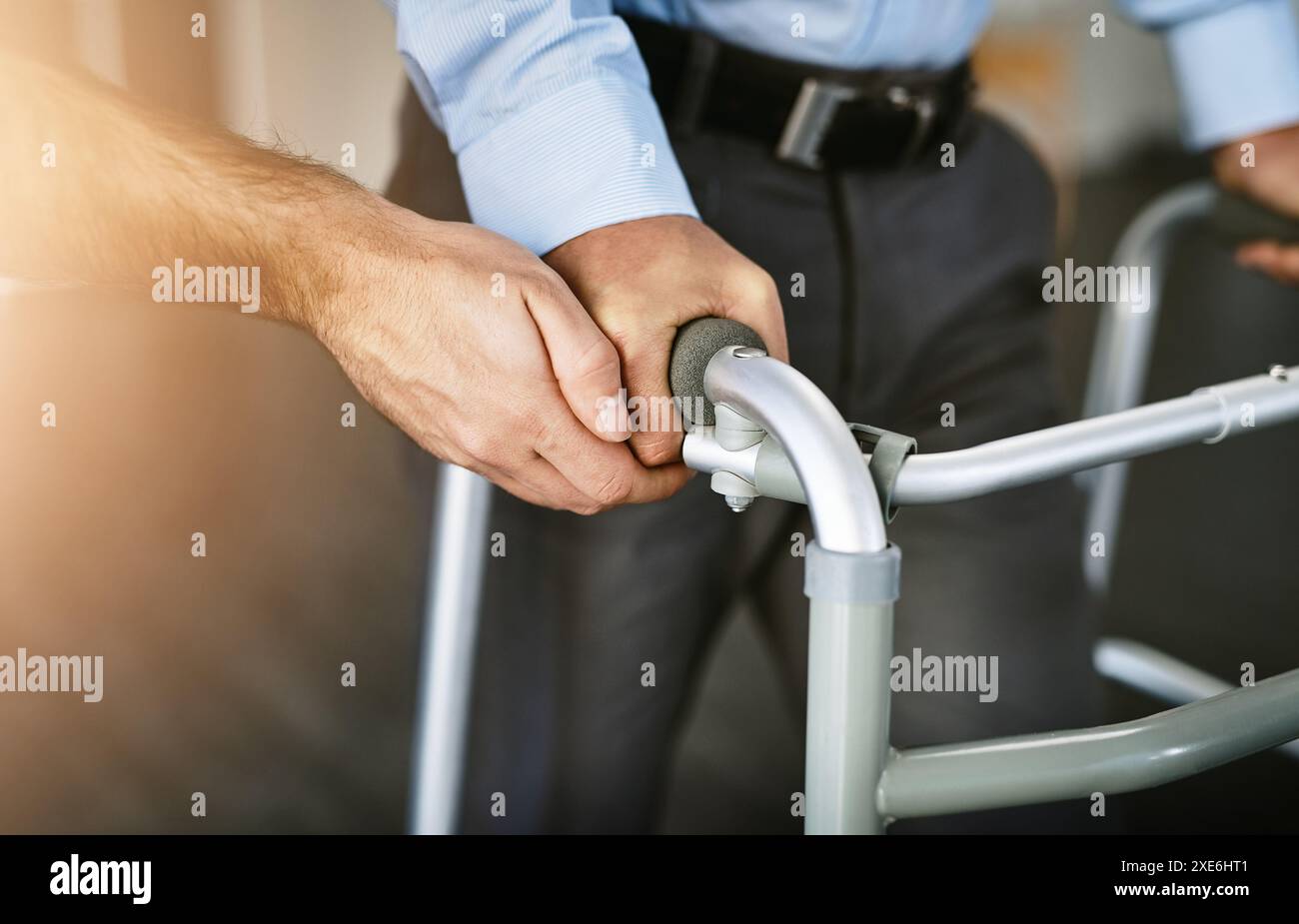 Hands, walker and help for person with disability in nursing home ...