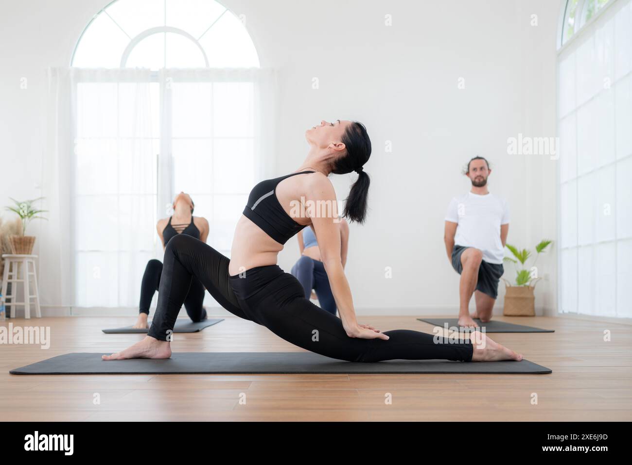 Group of people practicing yoga hi-res stock photography and images - Alamy