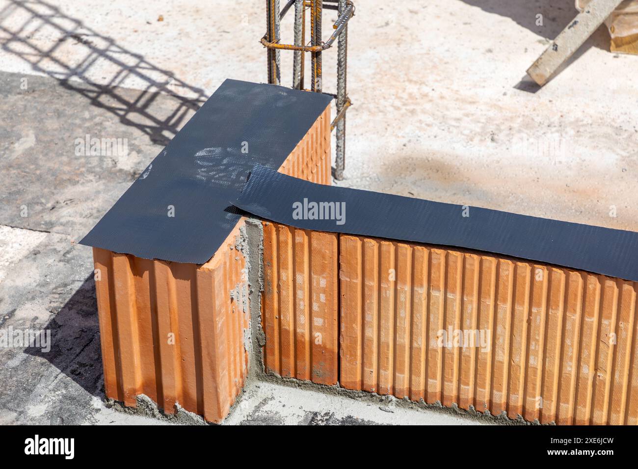 cellar wall insulation at the construction site with red brick stones ...