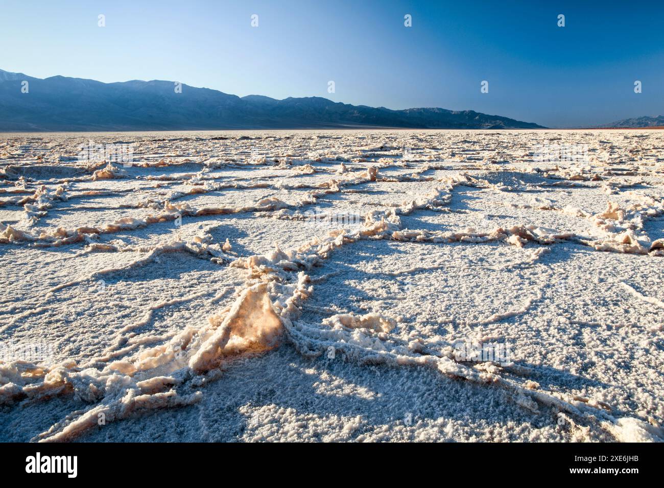 Salt crusts at the Badwater Basin salt flats in the Death Valley which ...