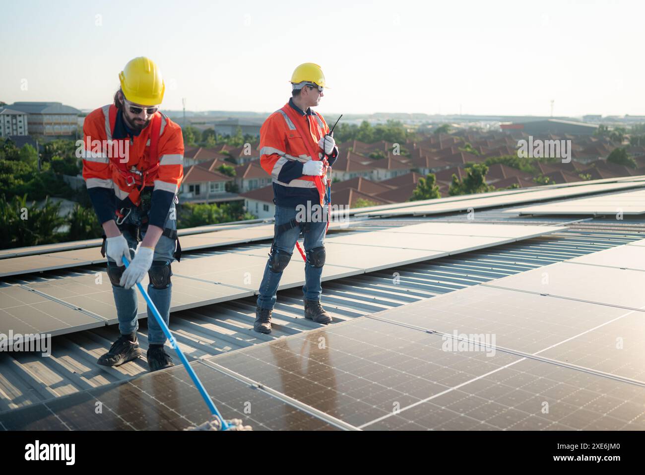 Engineer and technician working on the solar panel on the warehouse ...