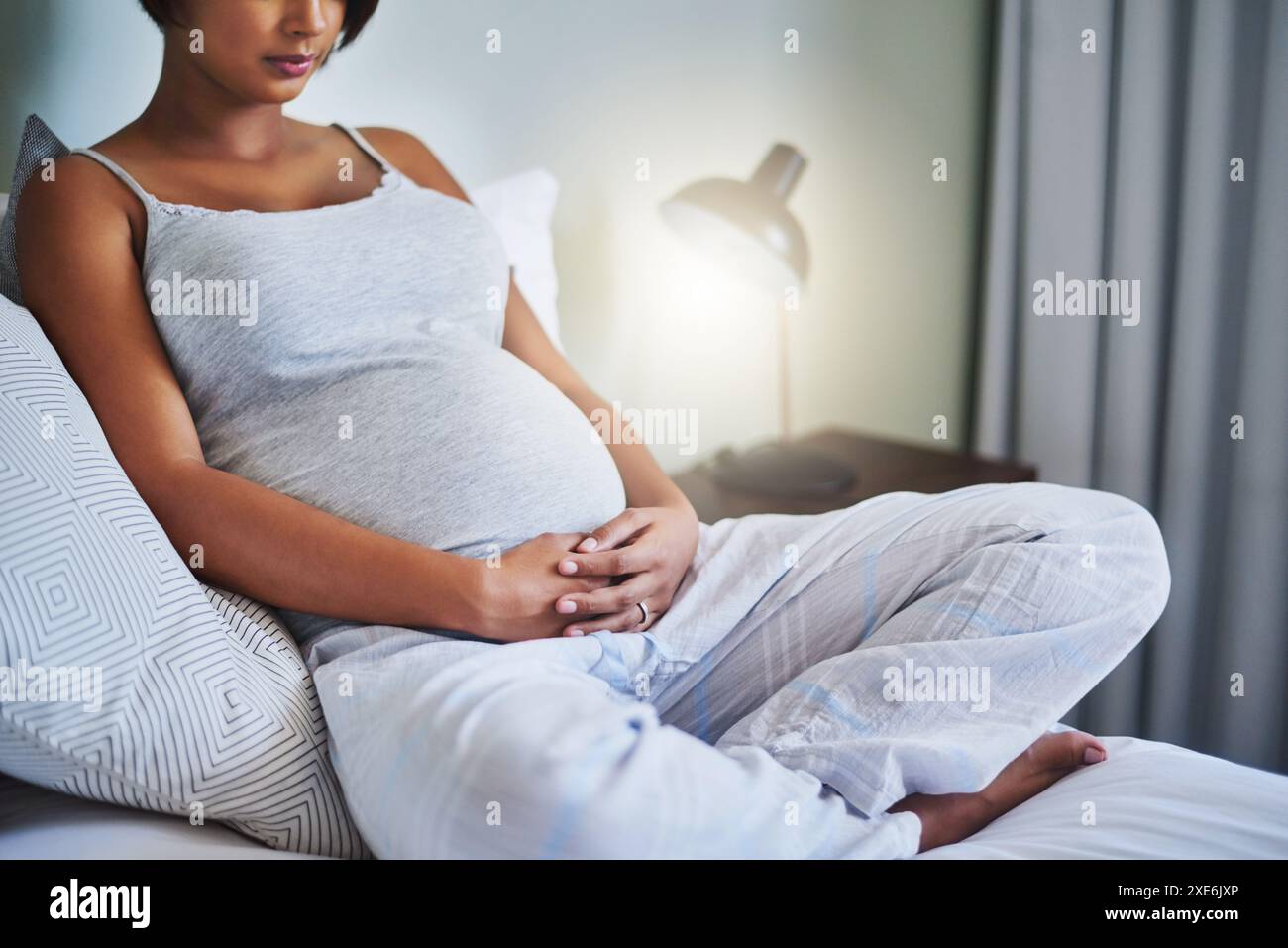 Woman, pregnant and hands on abdomen for pregnancy, bonding and ...