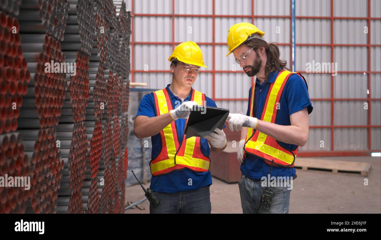 Warehouse workers in hard hats and helmets, Inspect and count steel in ...