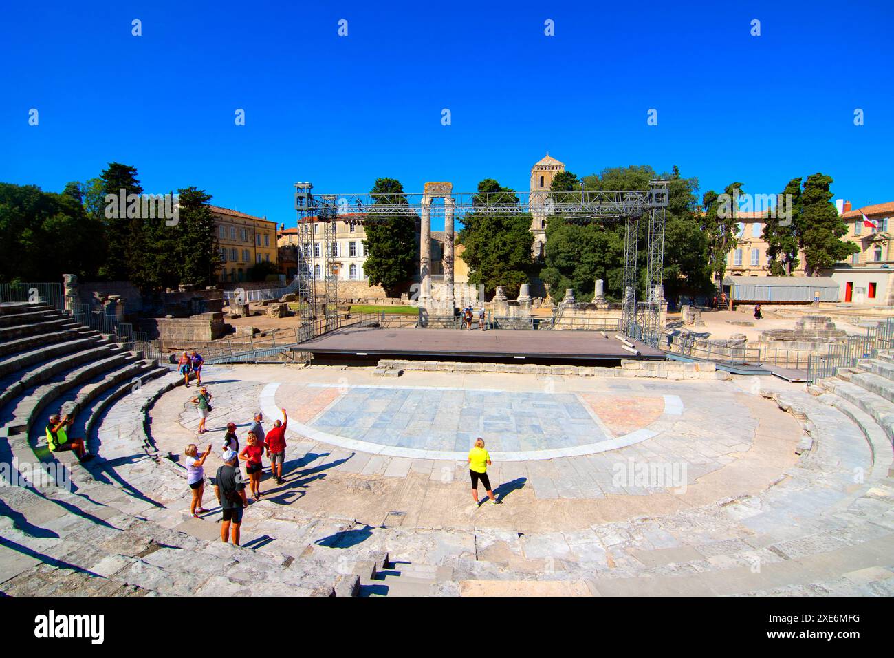 A group of tourists visit the Roman ruins in Arles, a city on the Rhone ...