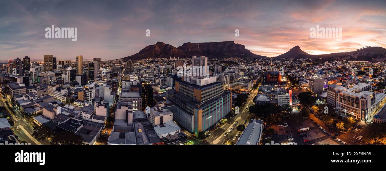 Aerial drone panoramic view of the cityscape as dusk sets in ...