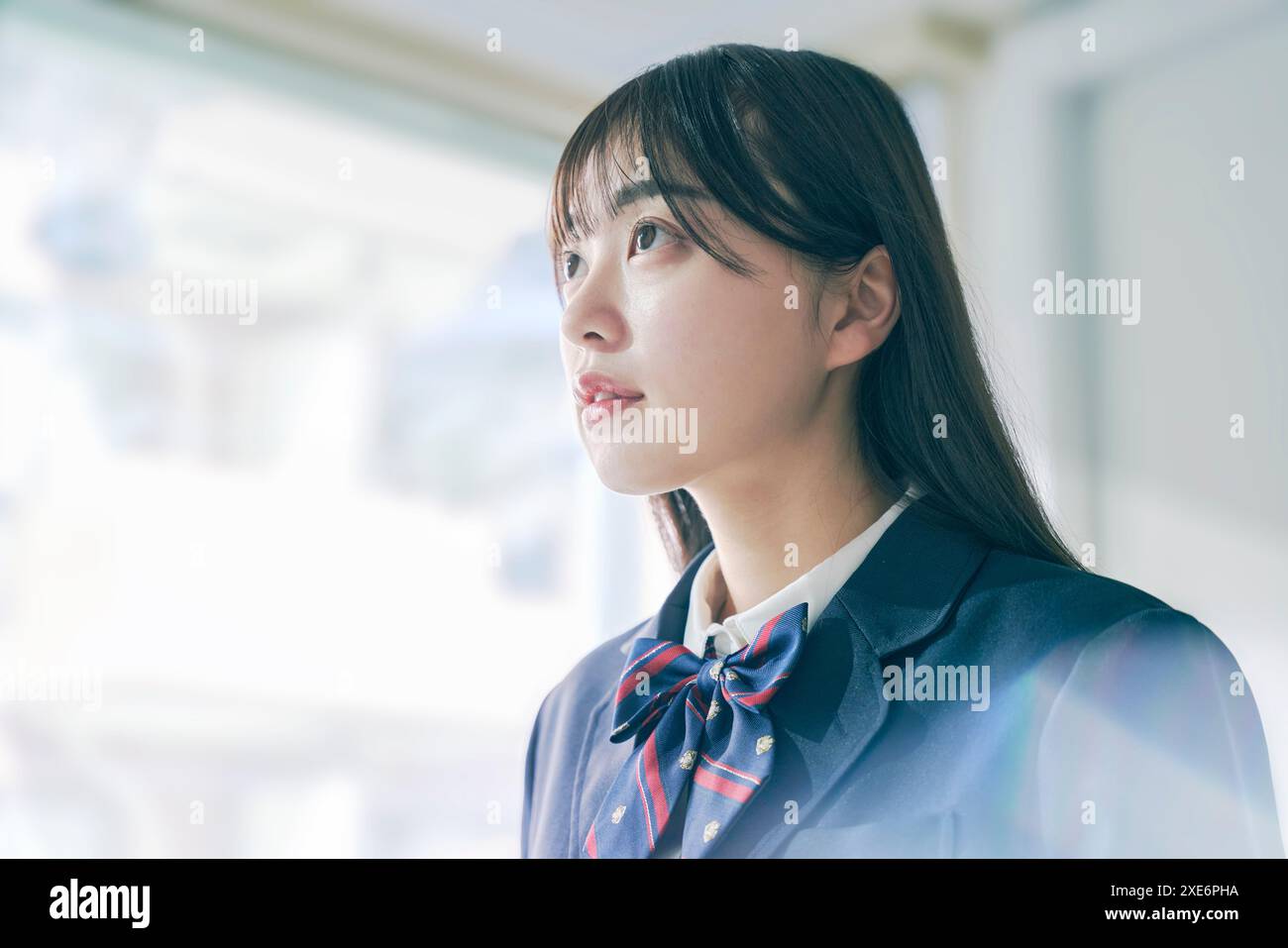 Female student taking class with serious eyes Stock Photo - Alamy