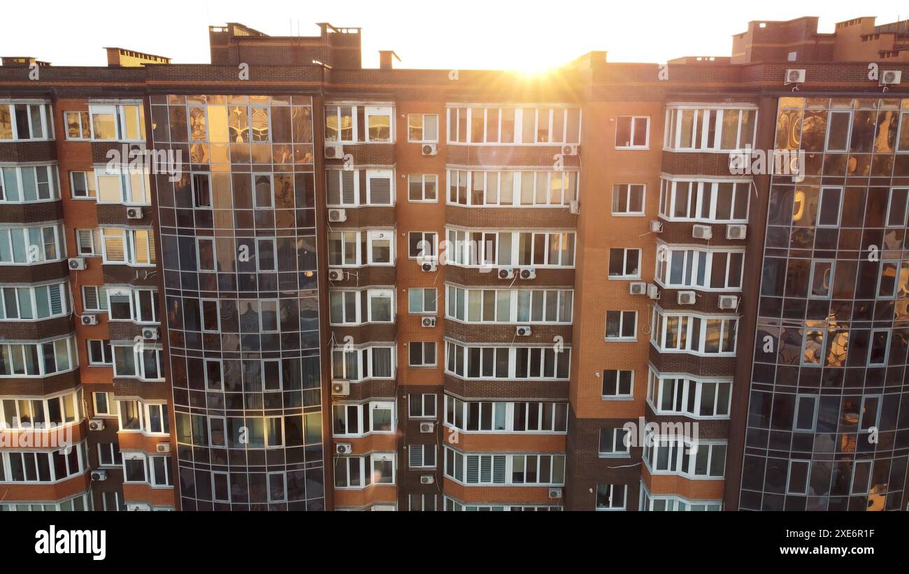 Sunlight streaming into tall building through windows, illuminating ...