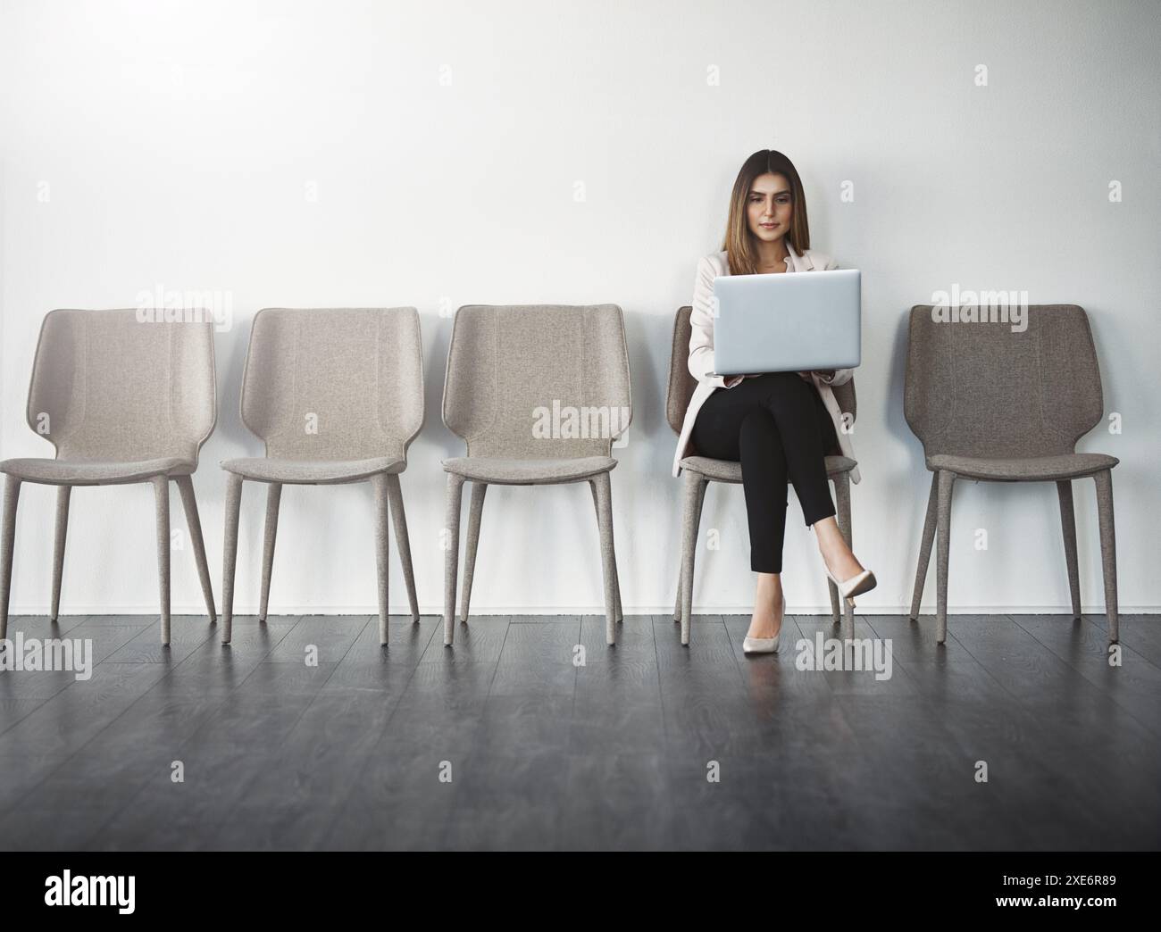 Recruitment, laptop and woman in waiting room for interview, job ...