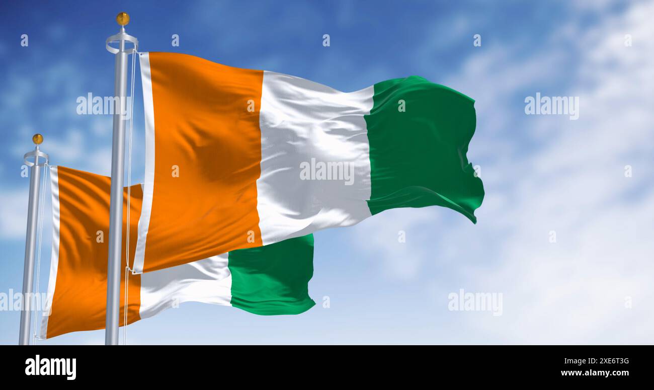 Ivory Coast national flag waving in the wind on a clear day Stock Photo ...
