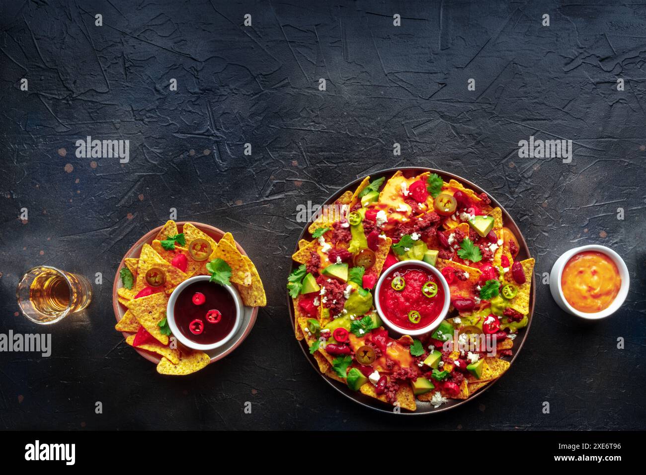 Loaded nachos. Mexican nacho chips with beef, overhead flat lay shot ...