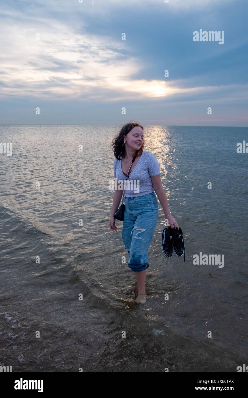 Woman walking sunset on edge hi-res stock photography and images - Alamy
