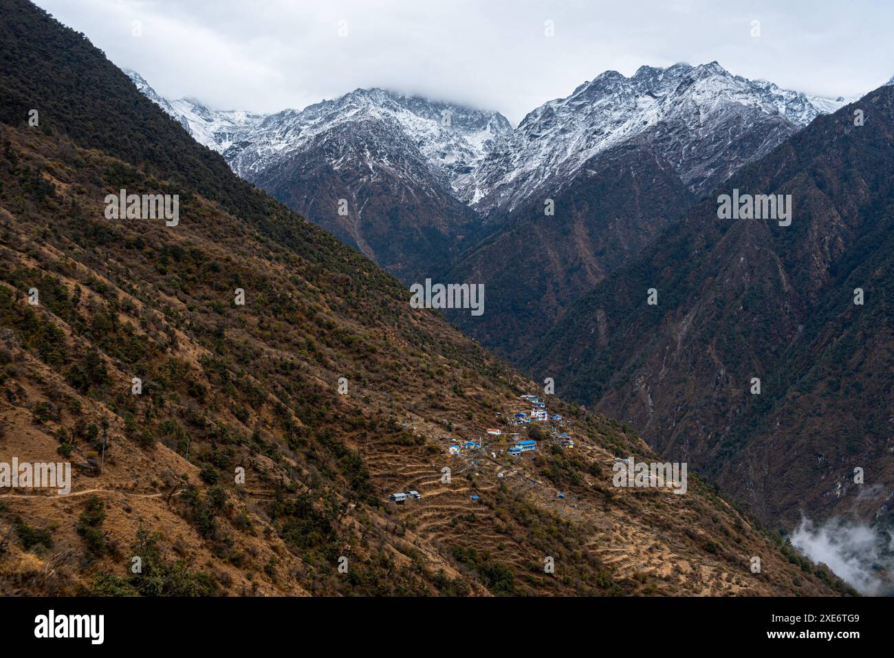 View along the vast valley with towering snowy mountains and Sherpagaon ...