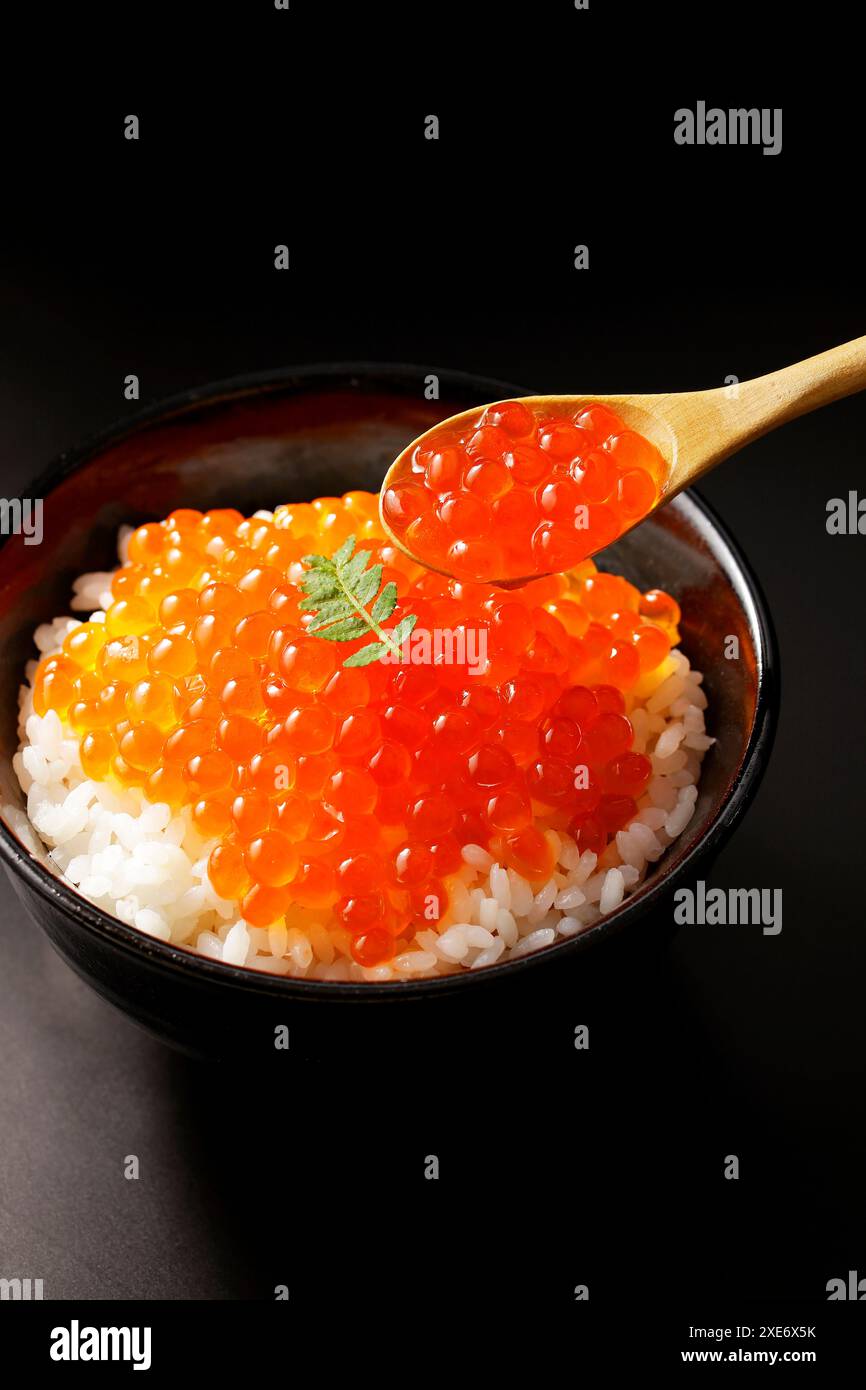 Soaked salmon roe in soy sauce on rice Stock Photo - Alamy
