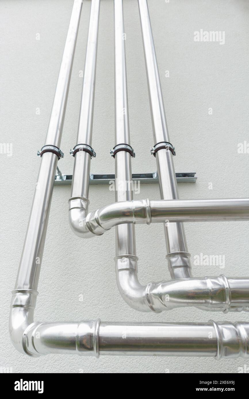 Stainless Steel Air Conditioning Pipes on Wall Stock Photo - Alamy
