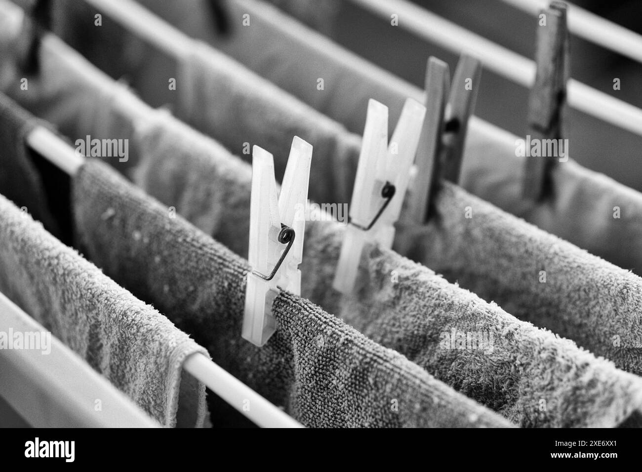 Hanging on a rack Black and White Stock Photos & Images - Alamy