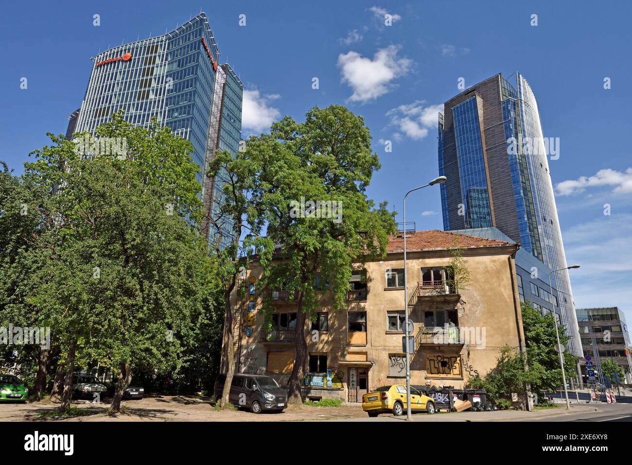 Old houses surrounded by modern office towers in the Snipiskes district ...
