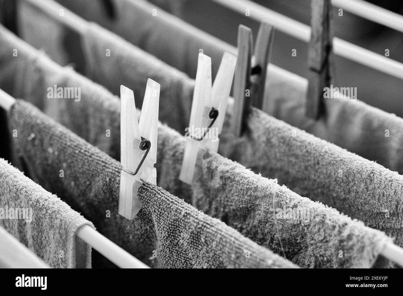 Hanging on a rack Black and White Stock Photos & Images - Alamy
