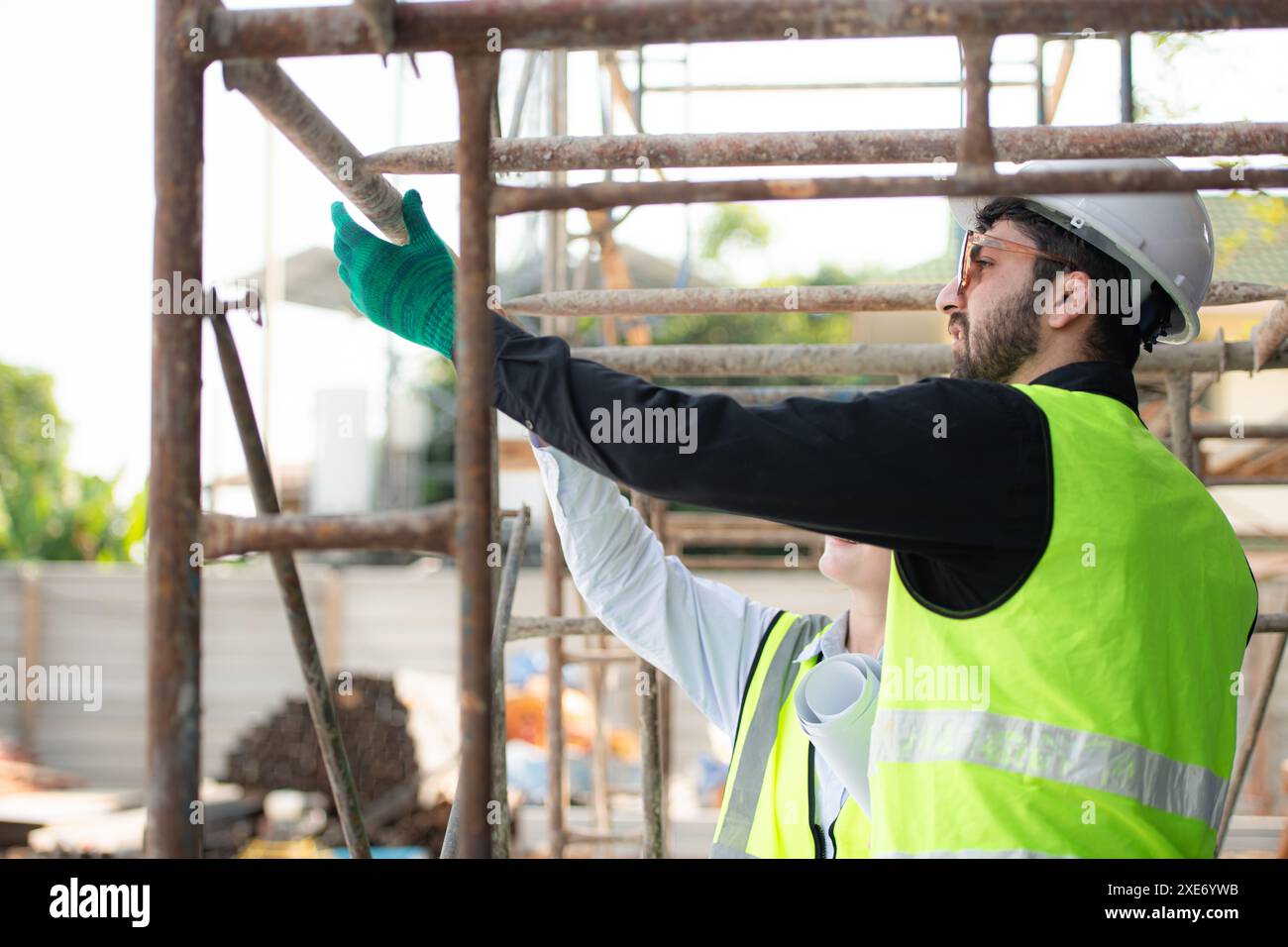 Engineer and architect working on the construction site, double ...