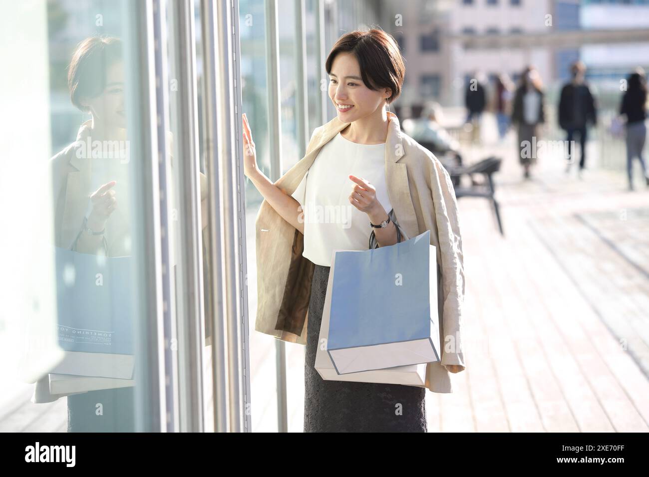 Japanese woman window shopping Stock Photo - Alamy