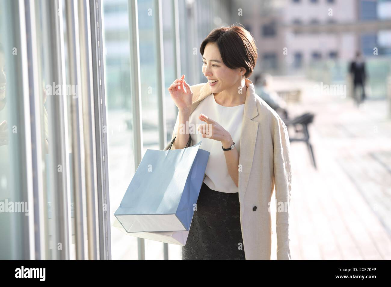 Japanese woman window shopping Stock Photo - Alamy