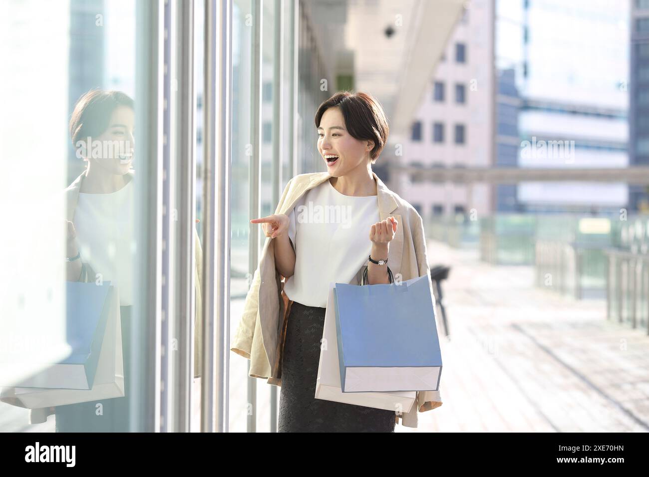Japanese woman window shopping Stock Photo - Alamy