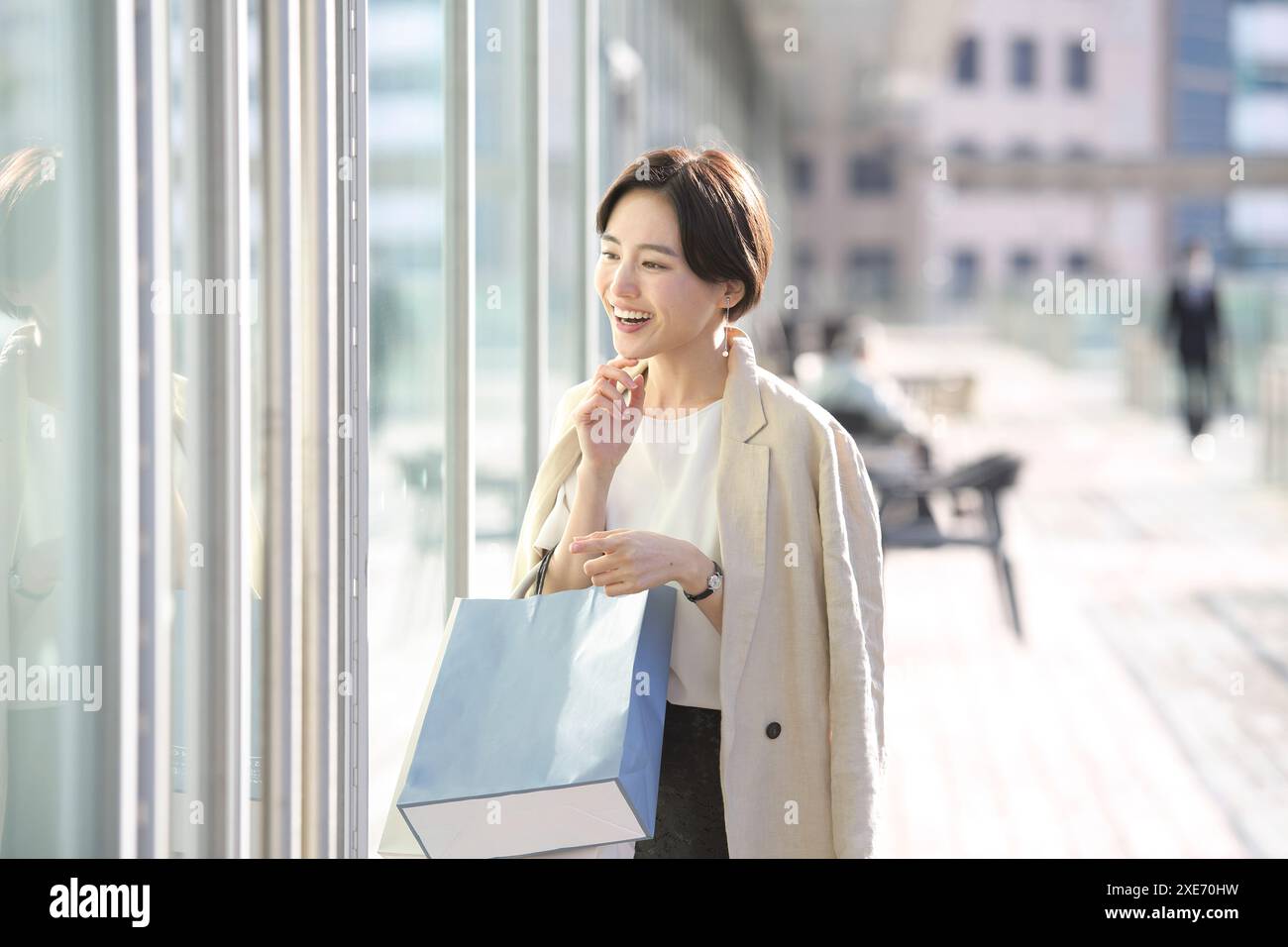 Japanese woman window shopping Stock Photo - Alamy