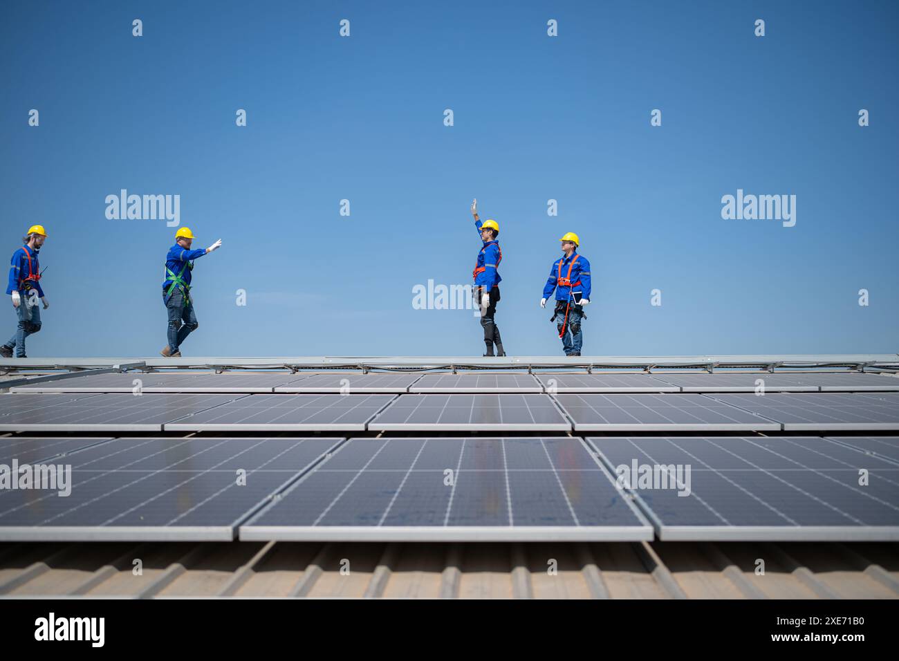 Group of people installing solar panels hi-res stock photography and ...
