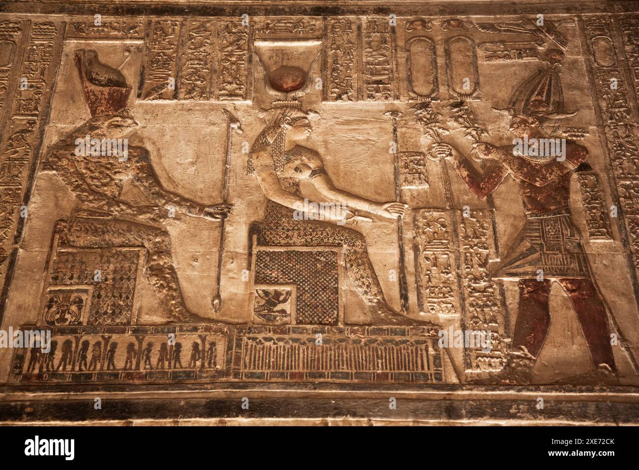 Reliefs of the God Horus on left, with Goddess Hathor in center and ...